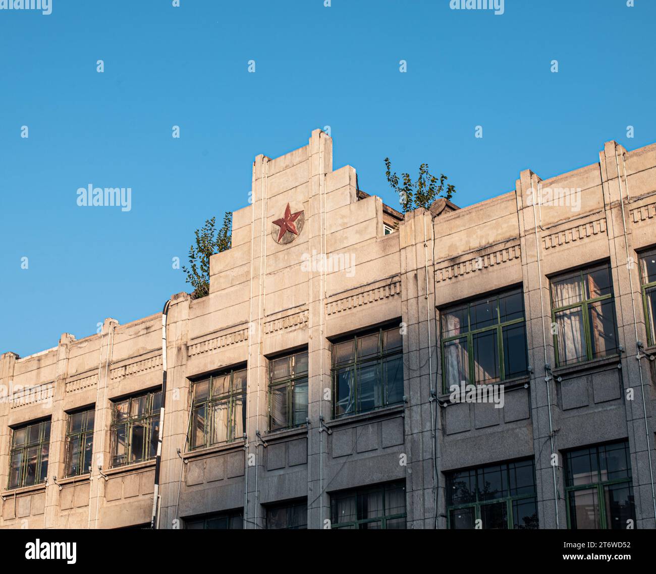 The facade of a building is decorated with stars and foliage, creating ...