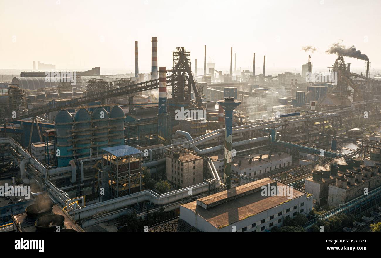 A large industrial plant is situated in a vast outdoor area, with clear ...