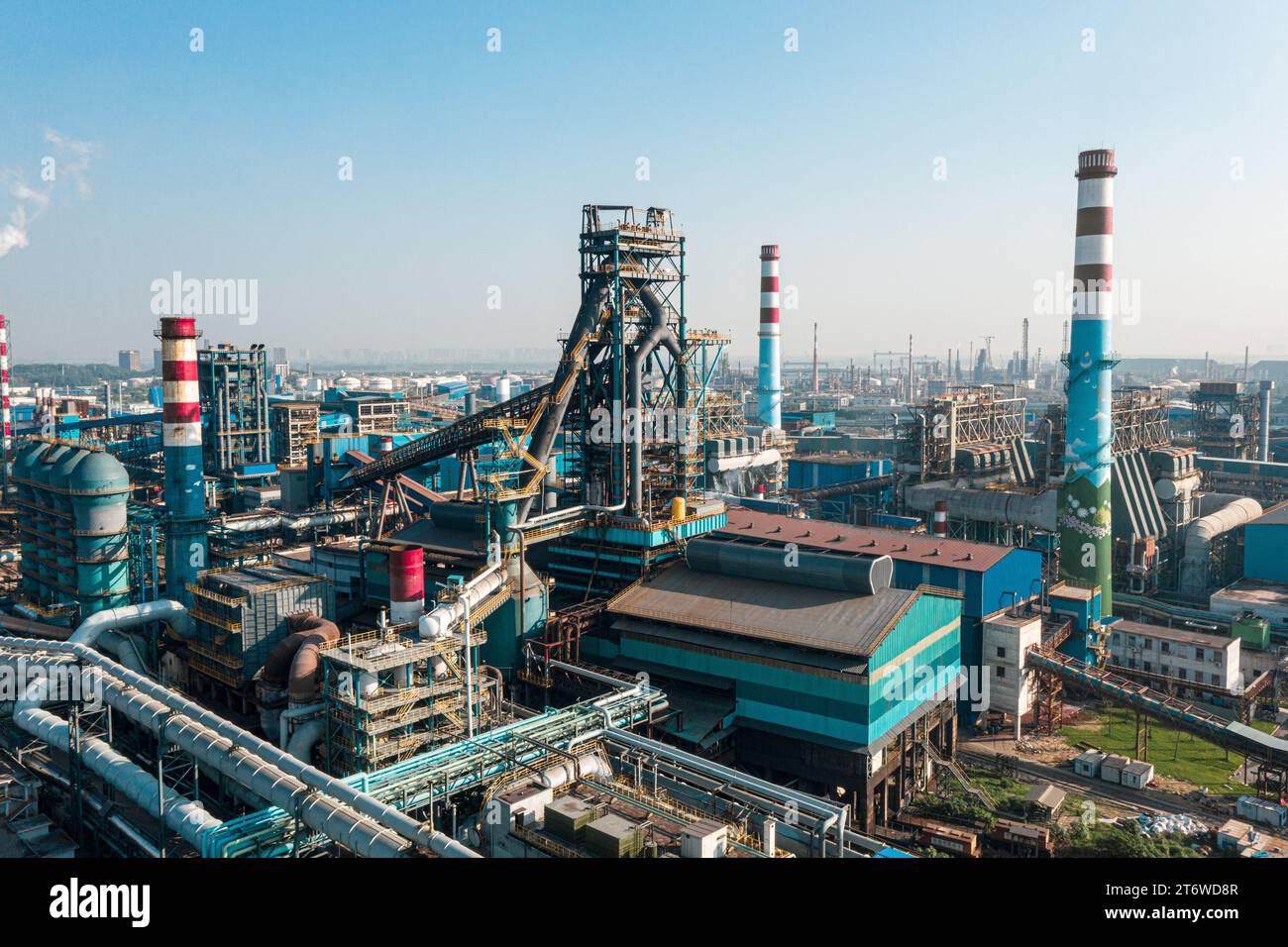 An industrial factory interior featuring a complex system of ...