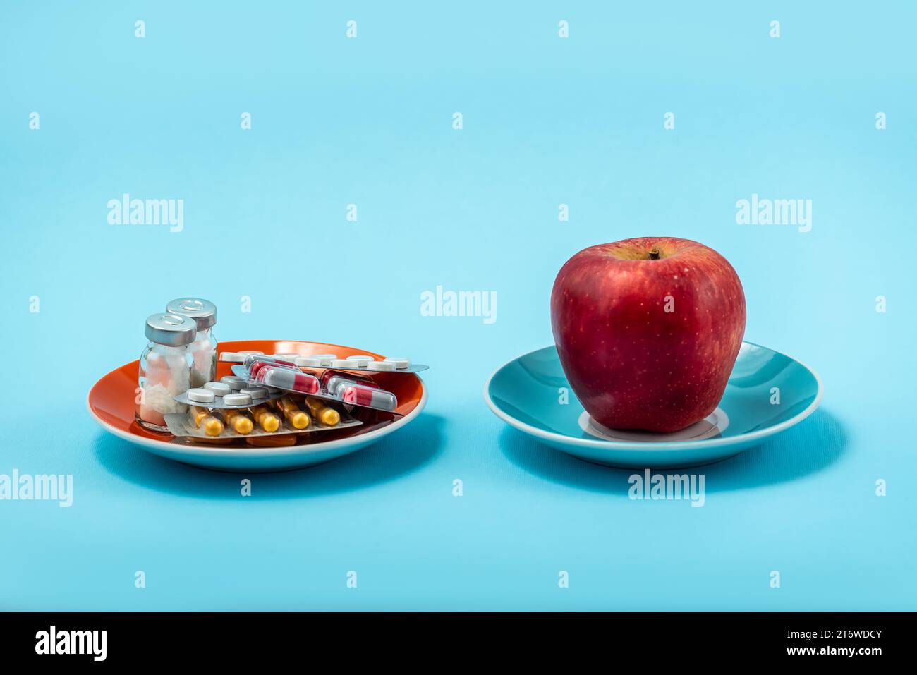 Pills capsules of medicament isolated on blue background versus red ...