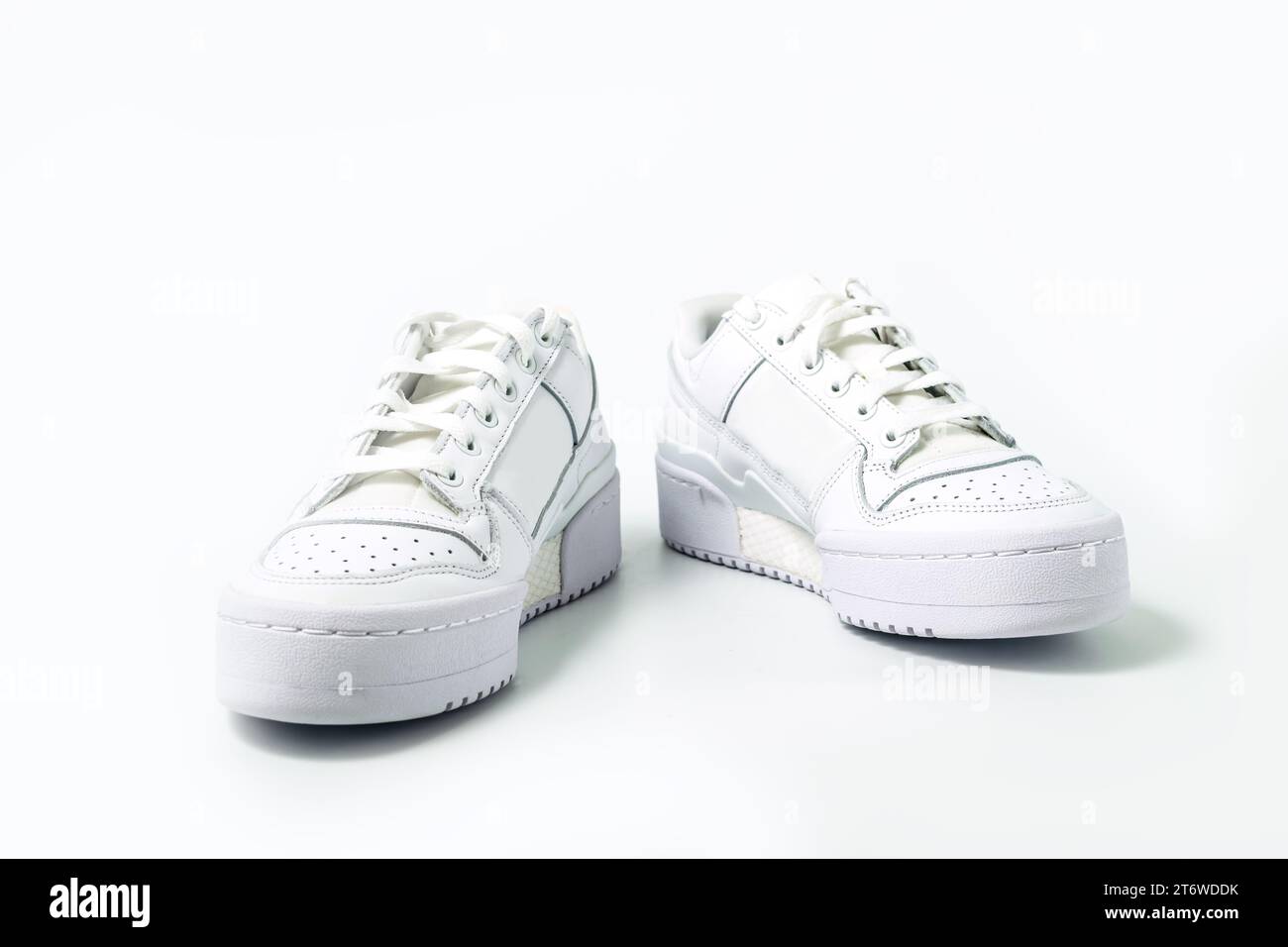 White tennis shoes isolated on white background Stock Photo - Alamy