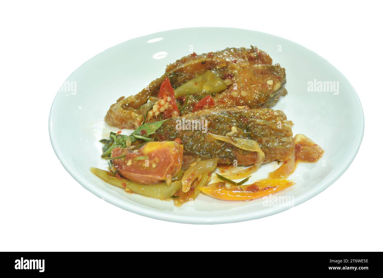 deep fried slice mango fish with tomato and chili in sweet sour sauce ...