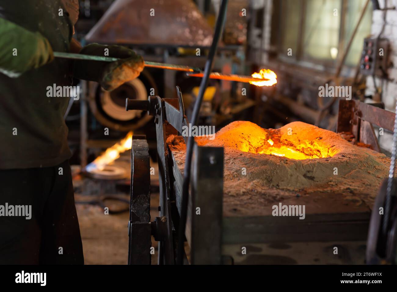 Foundry - ferrous metal is melted in an induction furnace of ...