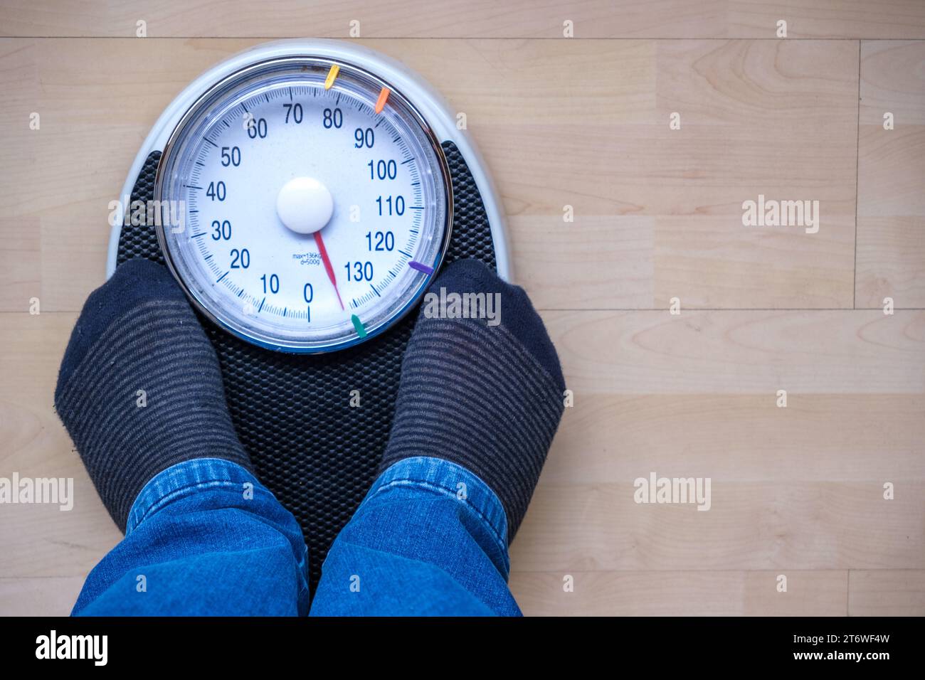 overwight person on a scale Stock Photo - Alamy