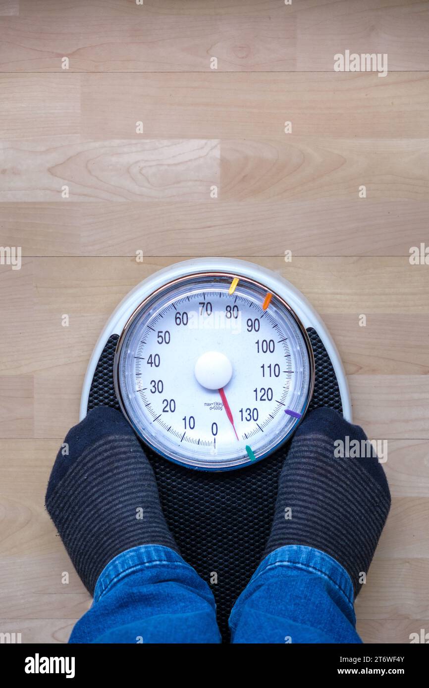 Feet on scales hi-res stock photography and images - Alamy
