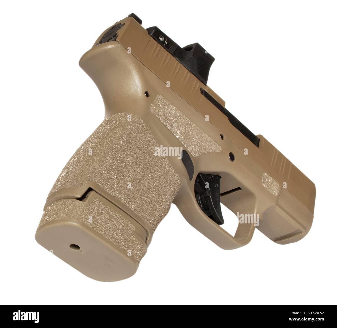 Brown semi auto pistol the is brown and chambered in 9 mm with a red ...