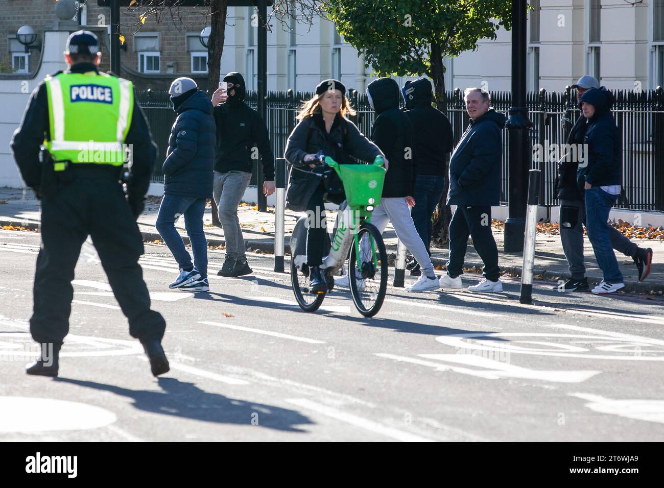 London, UK. 11th November, 2023. Right-wing counter-protesters observe ...
