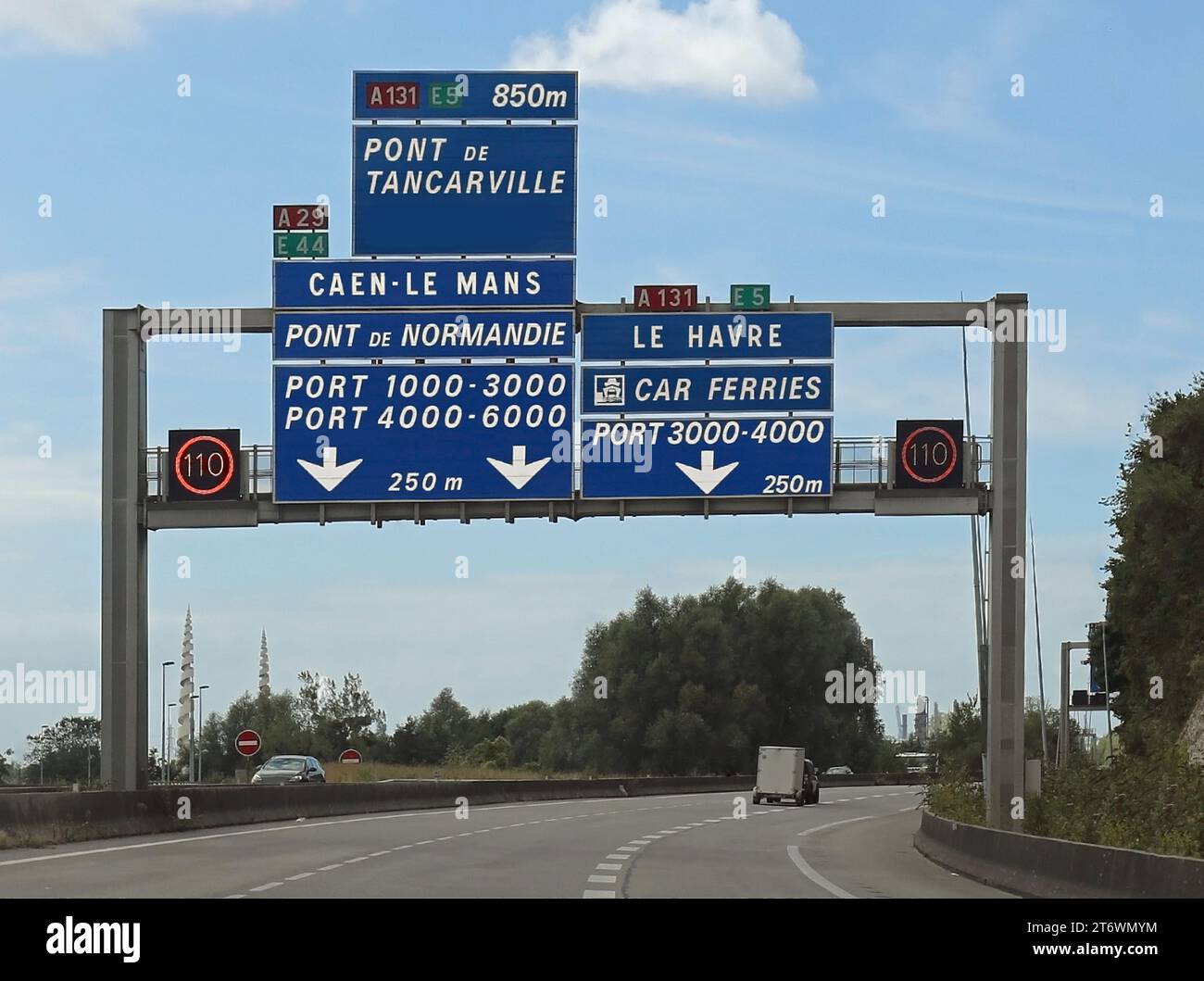large road sign with French locations to reach the port of LE Havre or ...
