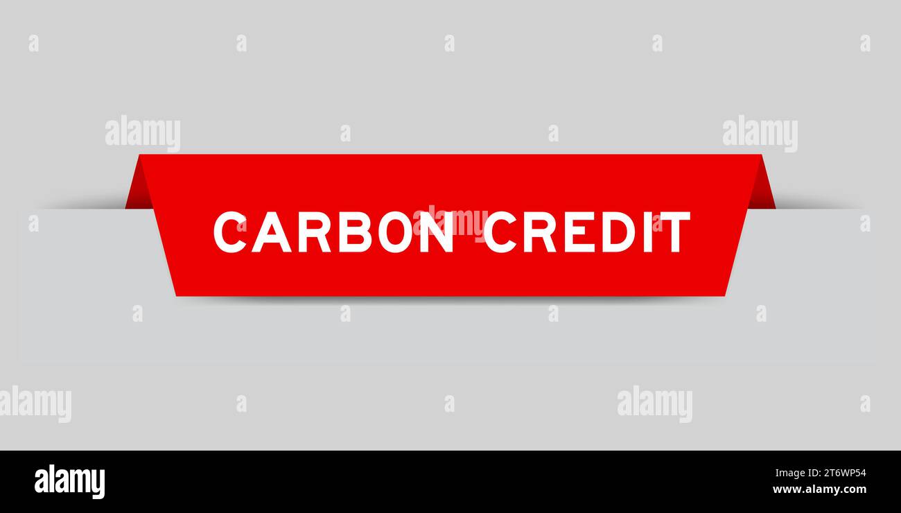 Red color inserted label with word carbon credit on gray background ...