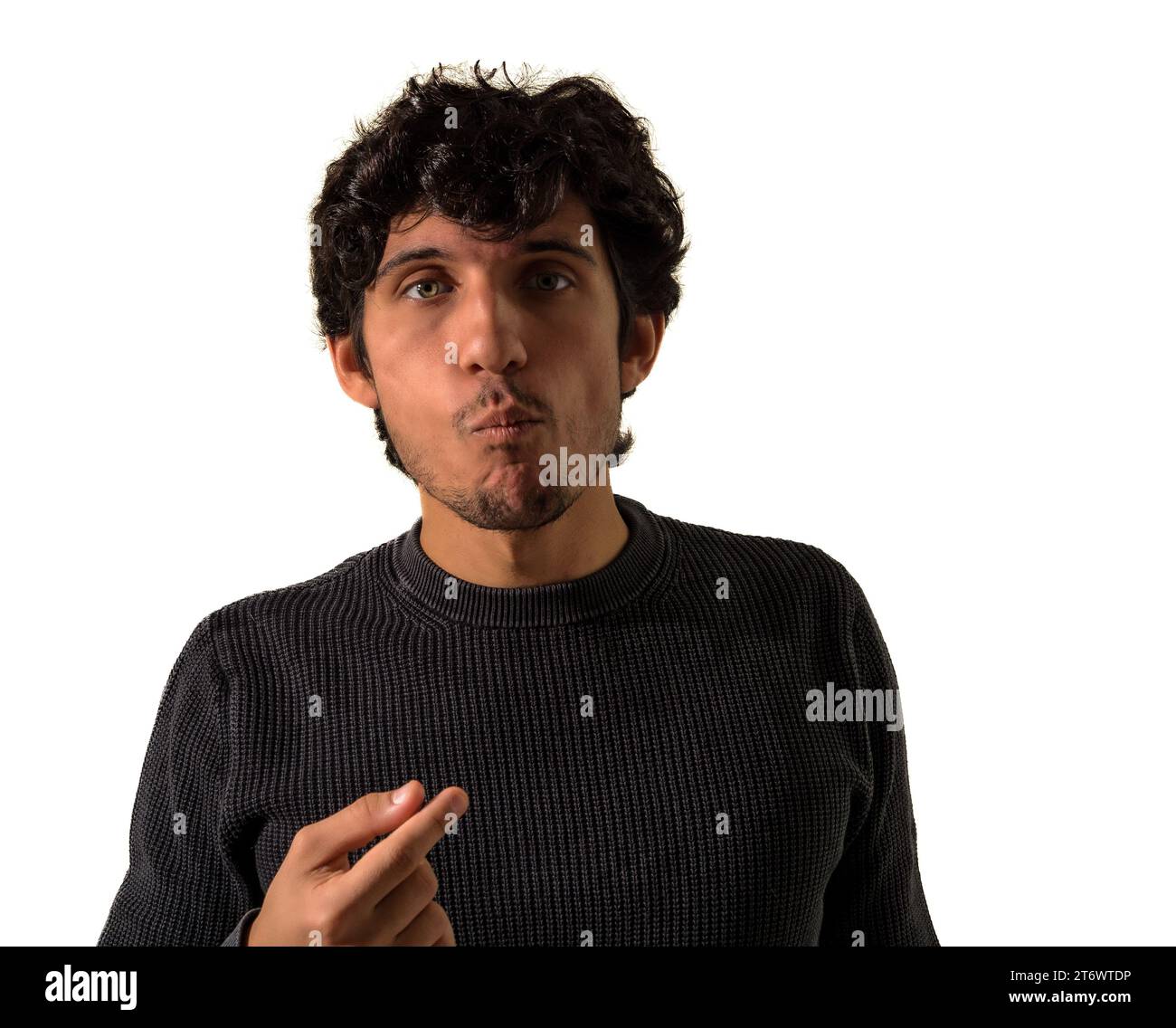 A young man eating, munching some food, isolated on white background ...