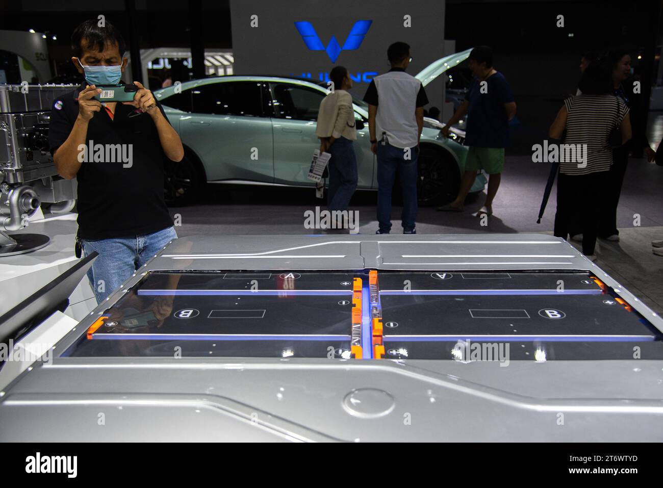 A visitor takes a photo of All-New BEV Lithium-ion Battery develop by ...