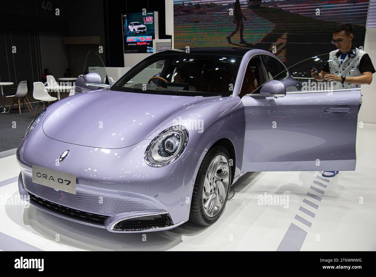 Visitor inspects a GMW Ora 07 car during the Green Technology Expo 2023 at Bangkok International ...