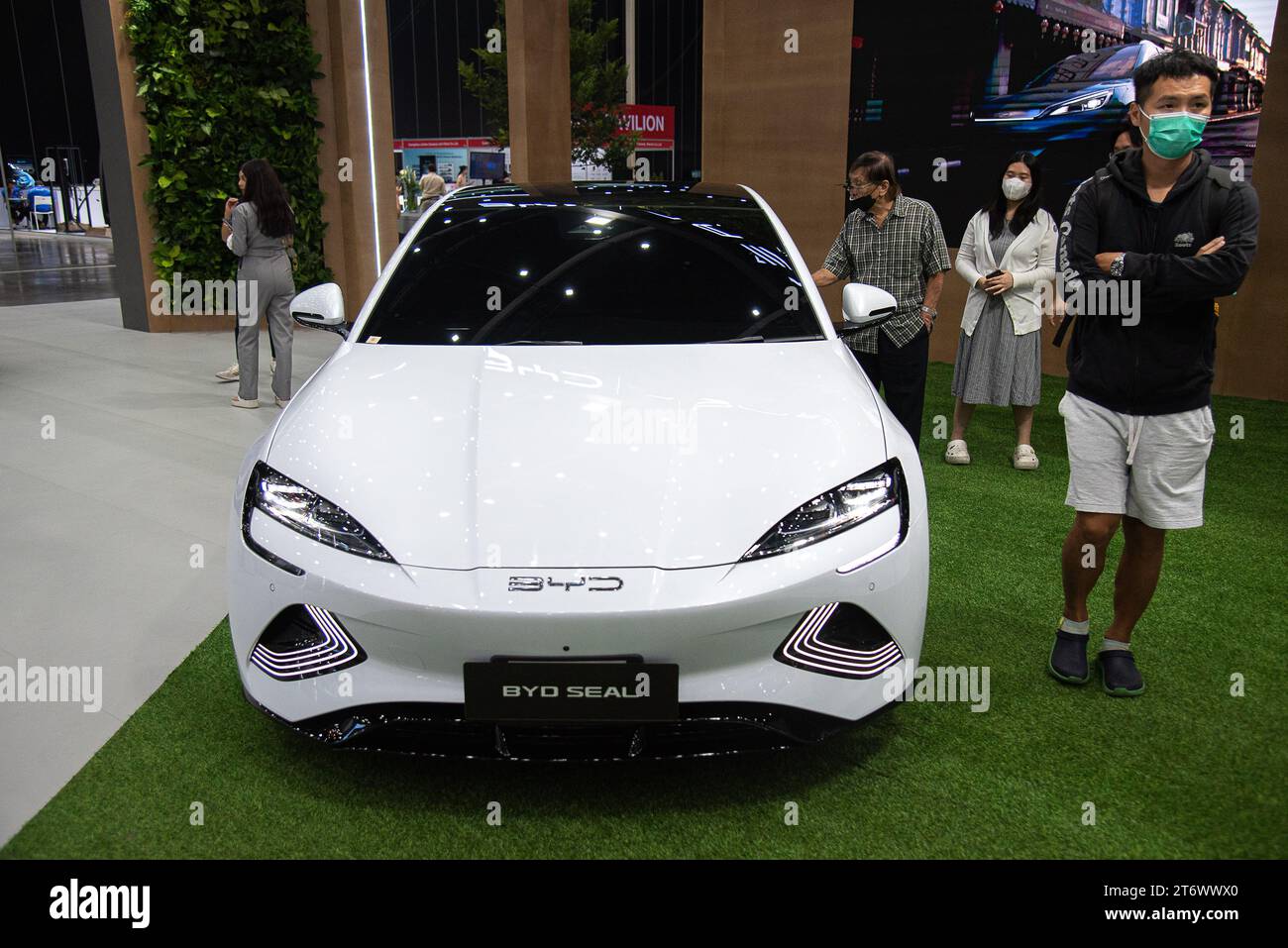 Visitors inspect a BYD Seal car during the Green Technology Expo 2023 ...