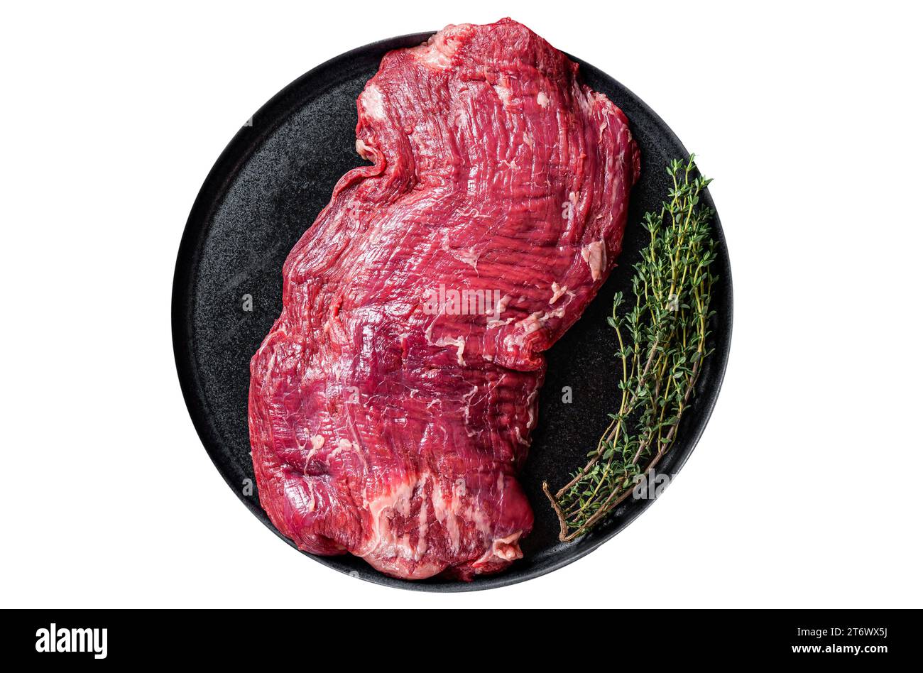 Flank or flap raw beef steak on plate with thyme. Isolated, white ...