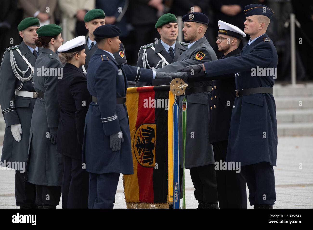 12 November 2023, Berlin: Recruits stand for the oath around a German ...