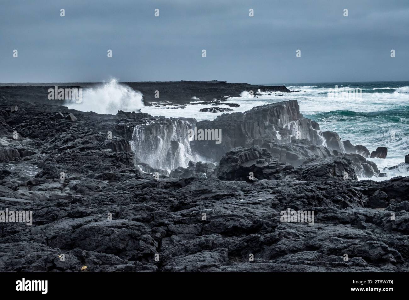 The harsh and wild SW coast of Iceland at Brimketill near the town of ...