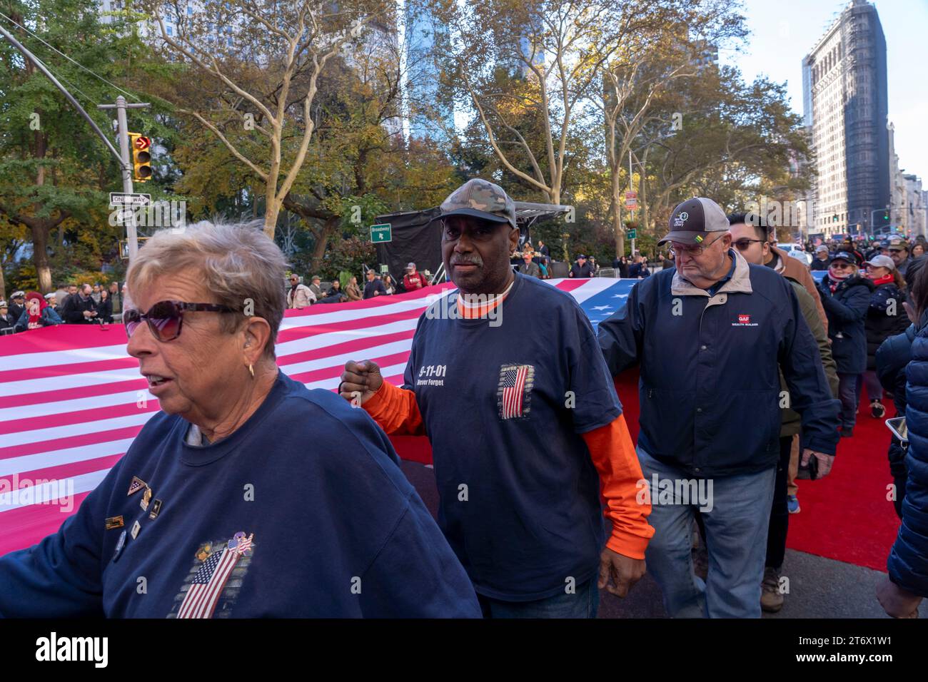 NEW YORK, NEW YORK - NOVEMBER 11: Ground Zero volunteers march with a ...