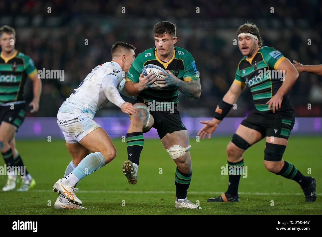 Northampton Saints' Sam Graham is tackled by Exeter Chiefs' Joe Hawkins ...