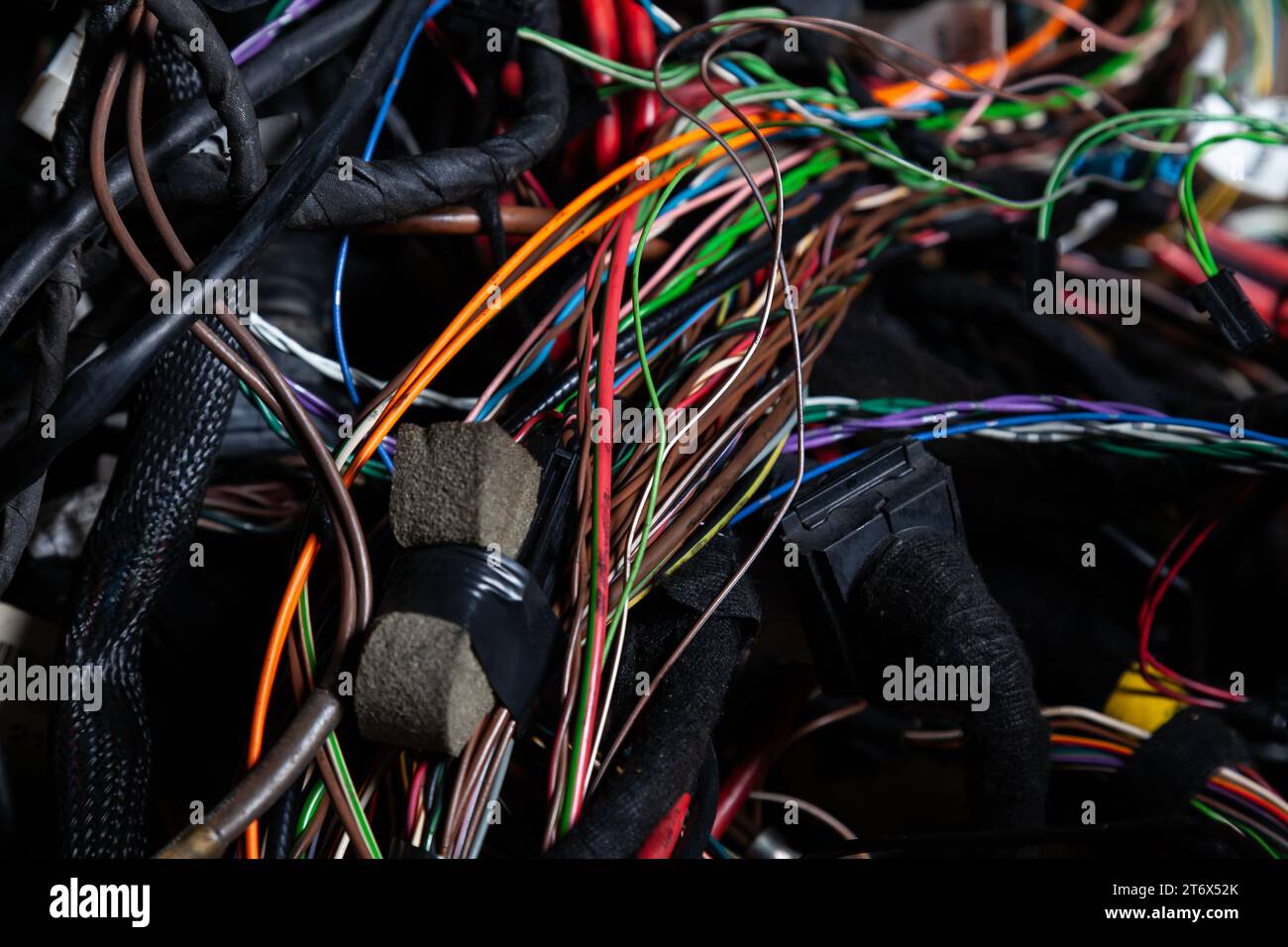 A cable of matted wires of different colors with connectors in the ...