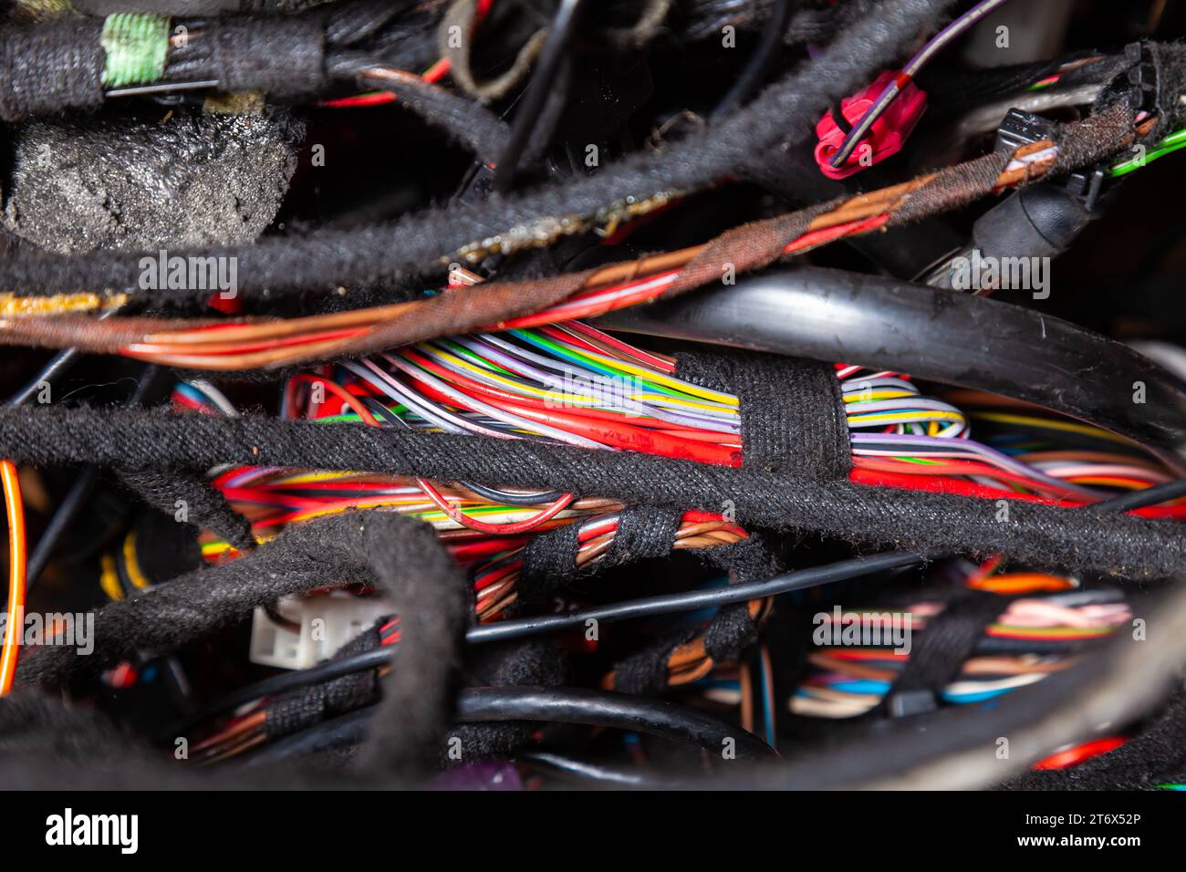 A cable of matted wires of different colors with connectors in the ...