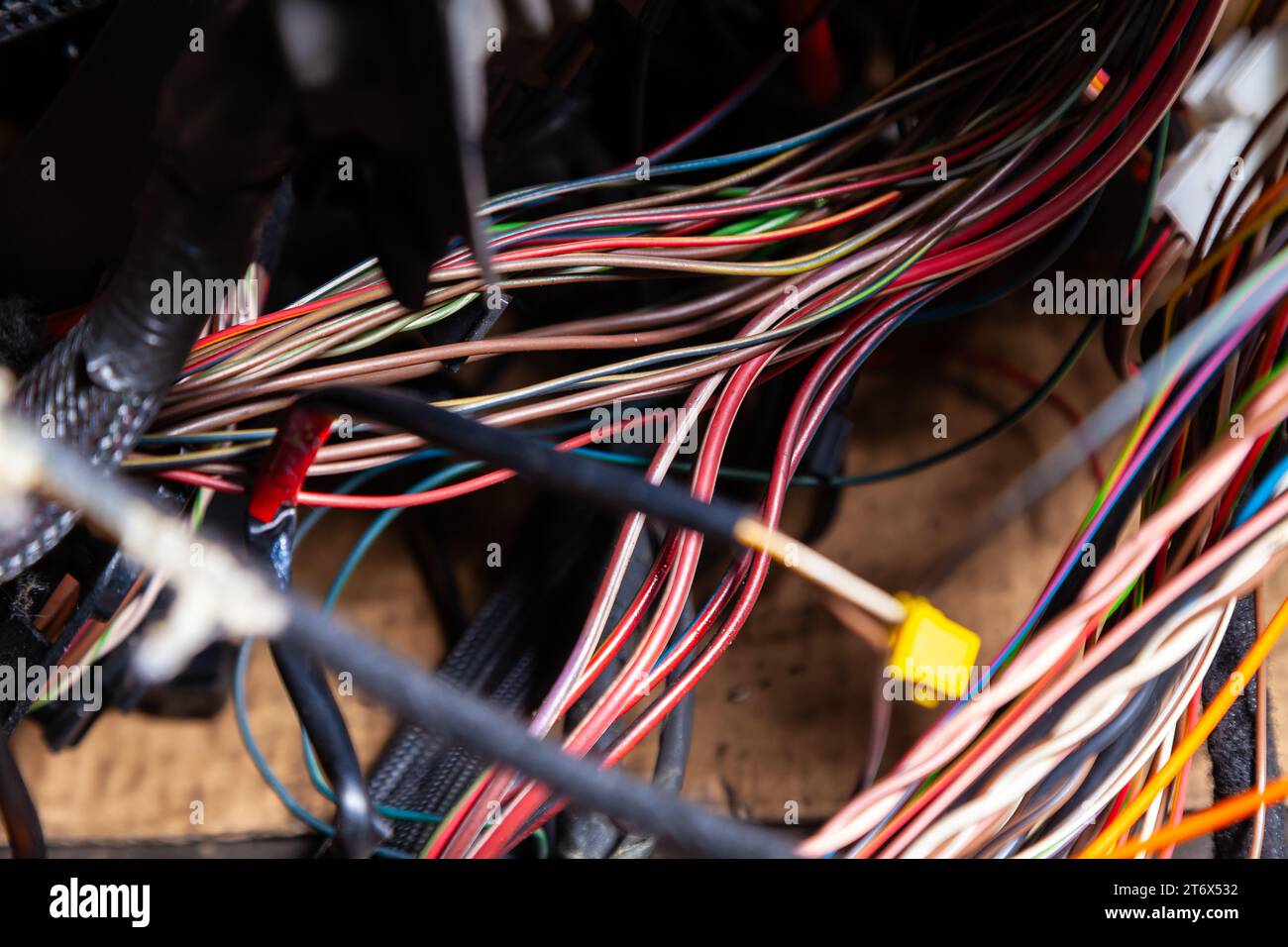 A cable of matted wires of different colors with connectors in the ...