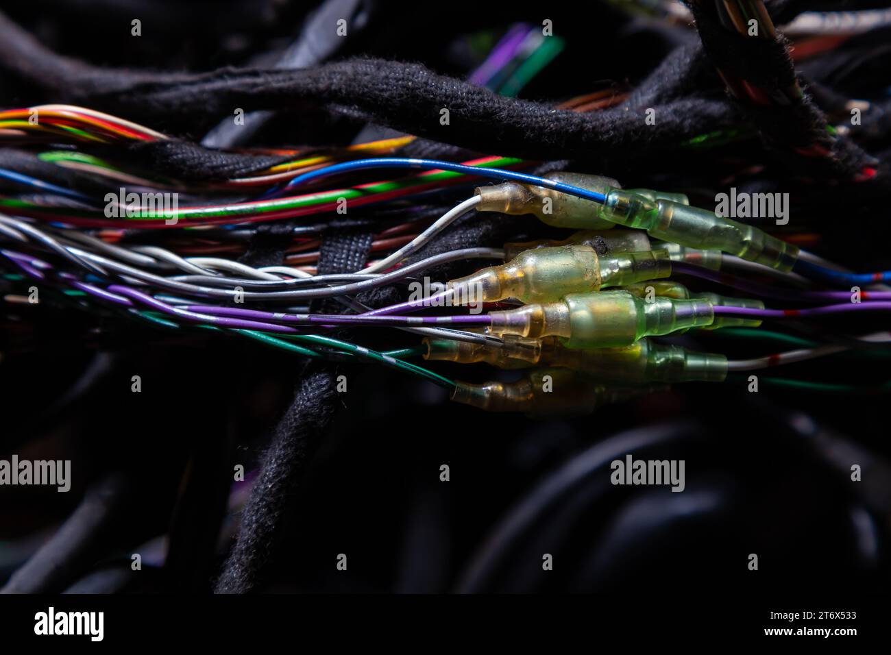 A cable of matted wires of different colors with connectors in the ...