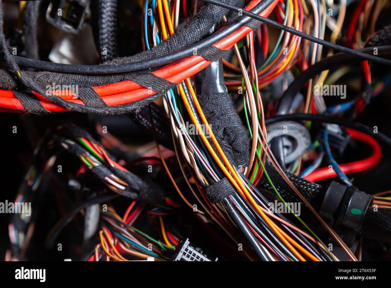 A cable of matted wires of different colors with connectors in the ...