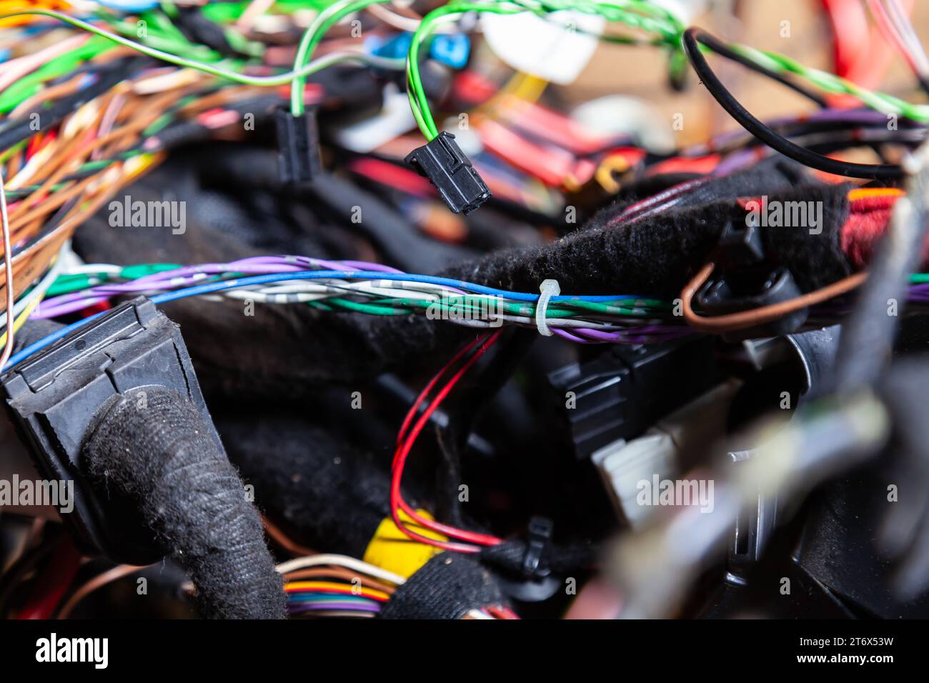 A cable of matted wires of different colors with connectors in the ...