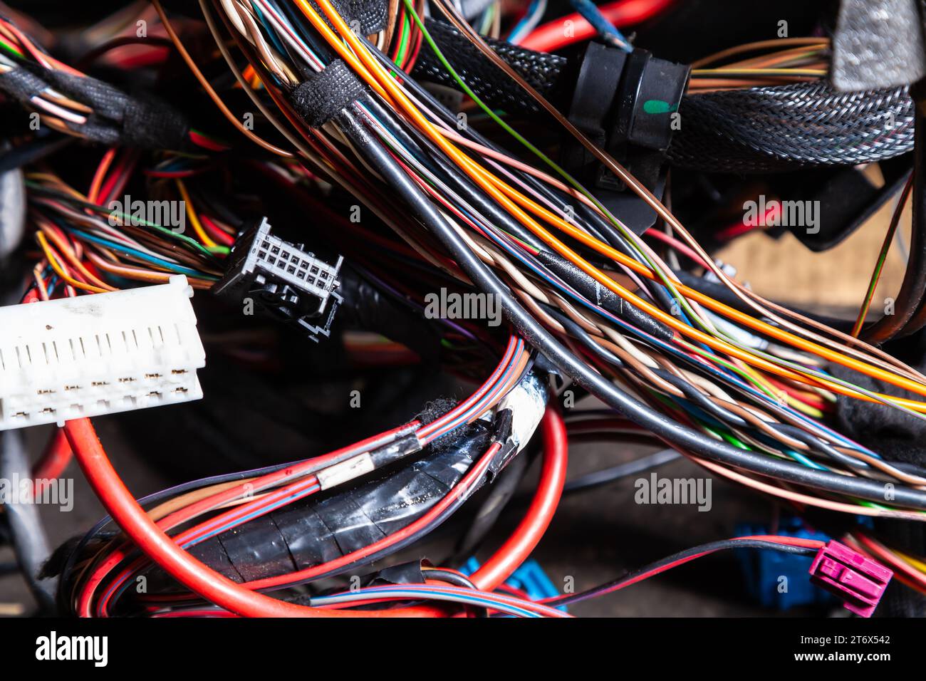 A cable of matted wires of different colors with connectors in the ...