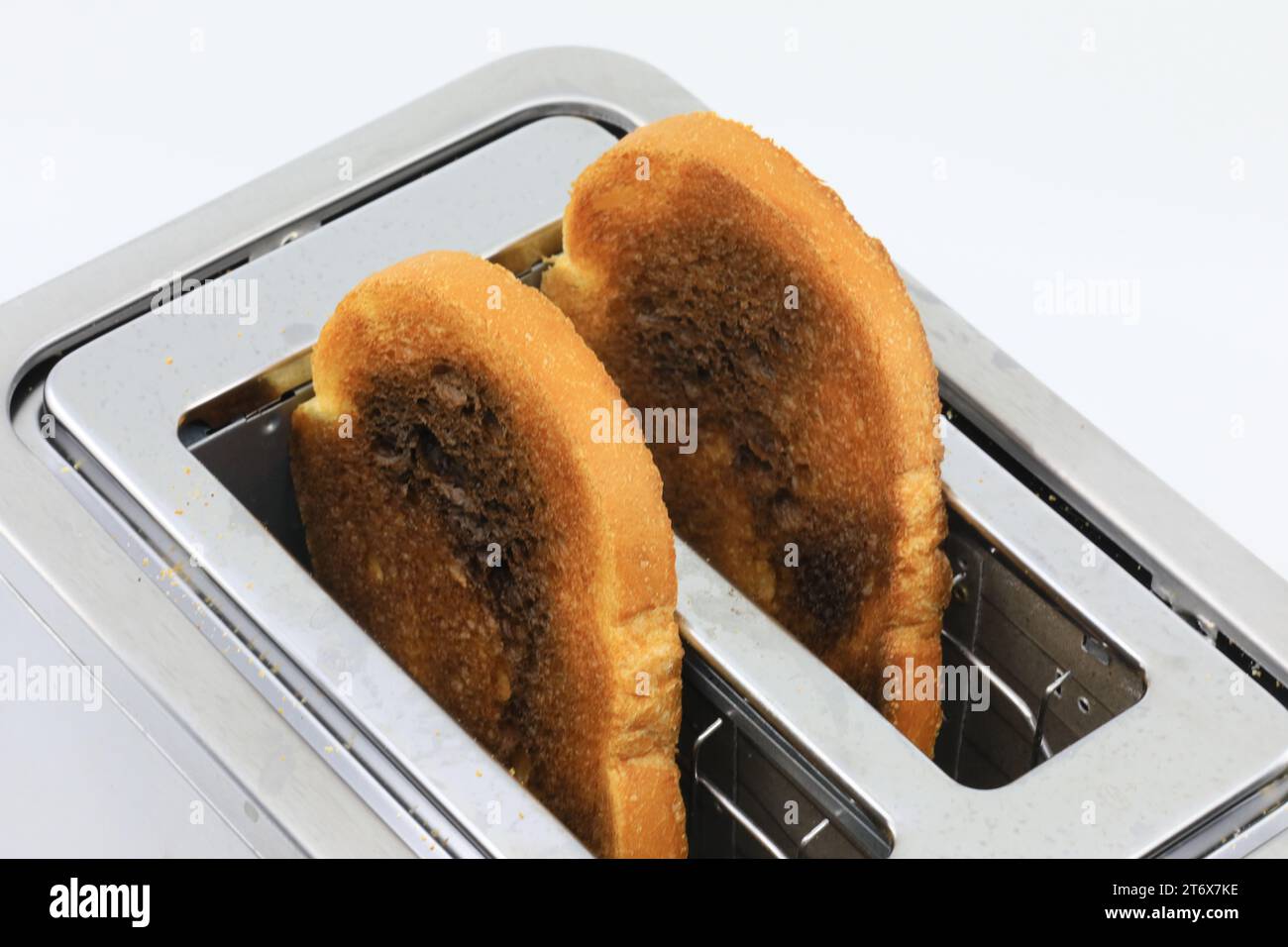 Popped Toaster with burnt toast Stock Photo - Alamy