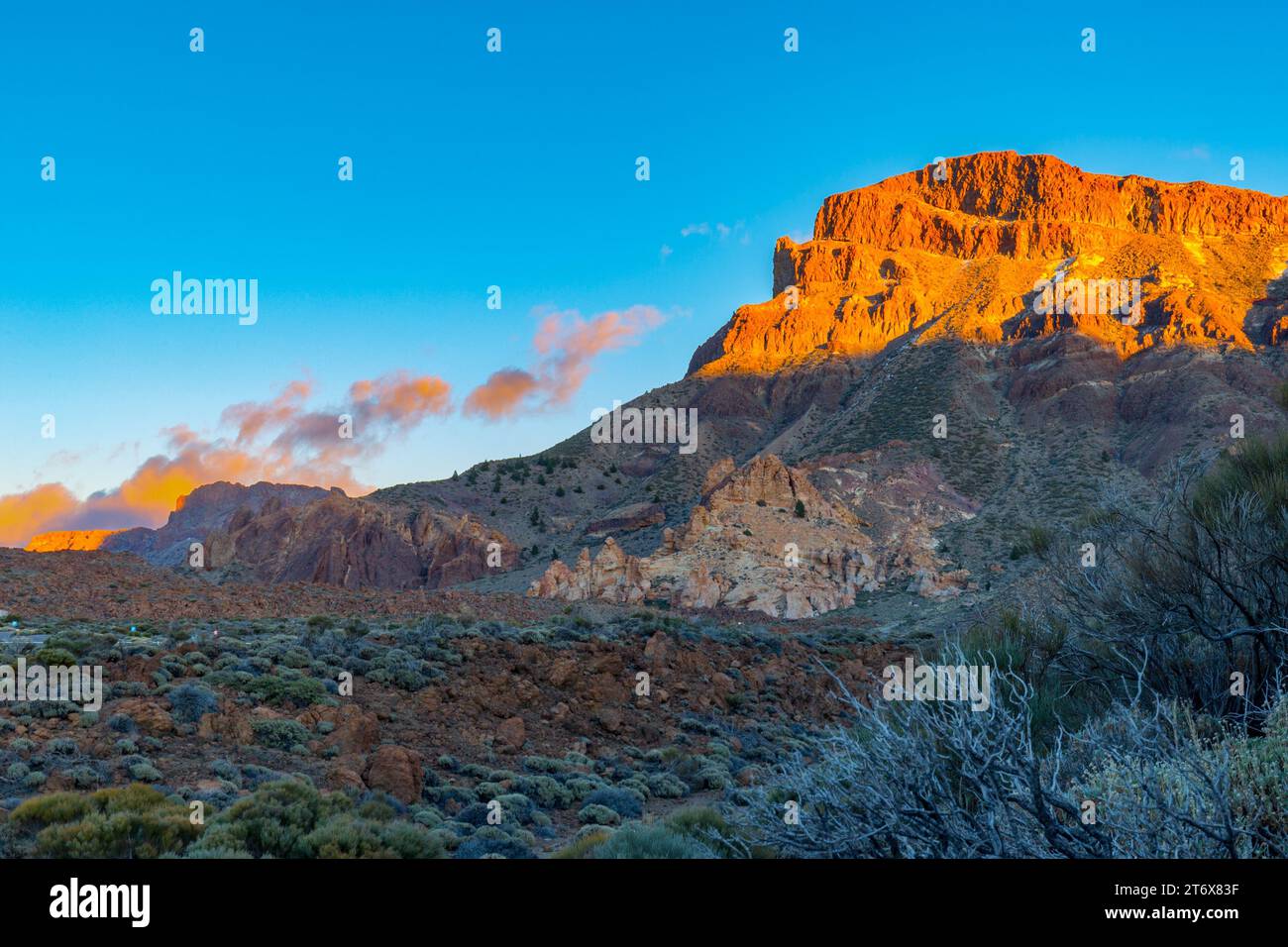 A stunning sunrise in the desert landscape, with rays of light shining ...