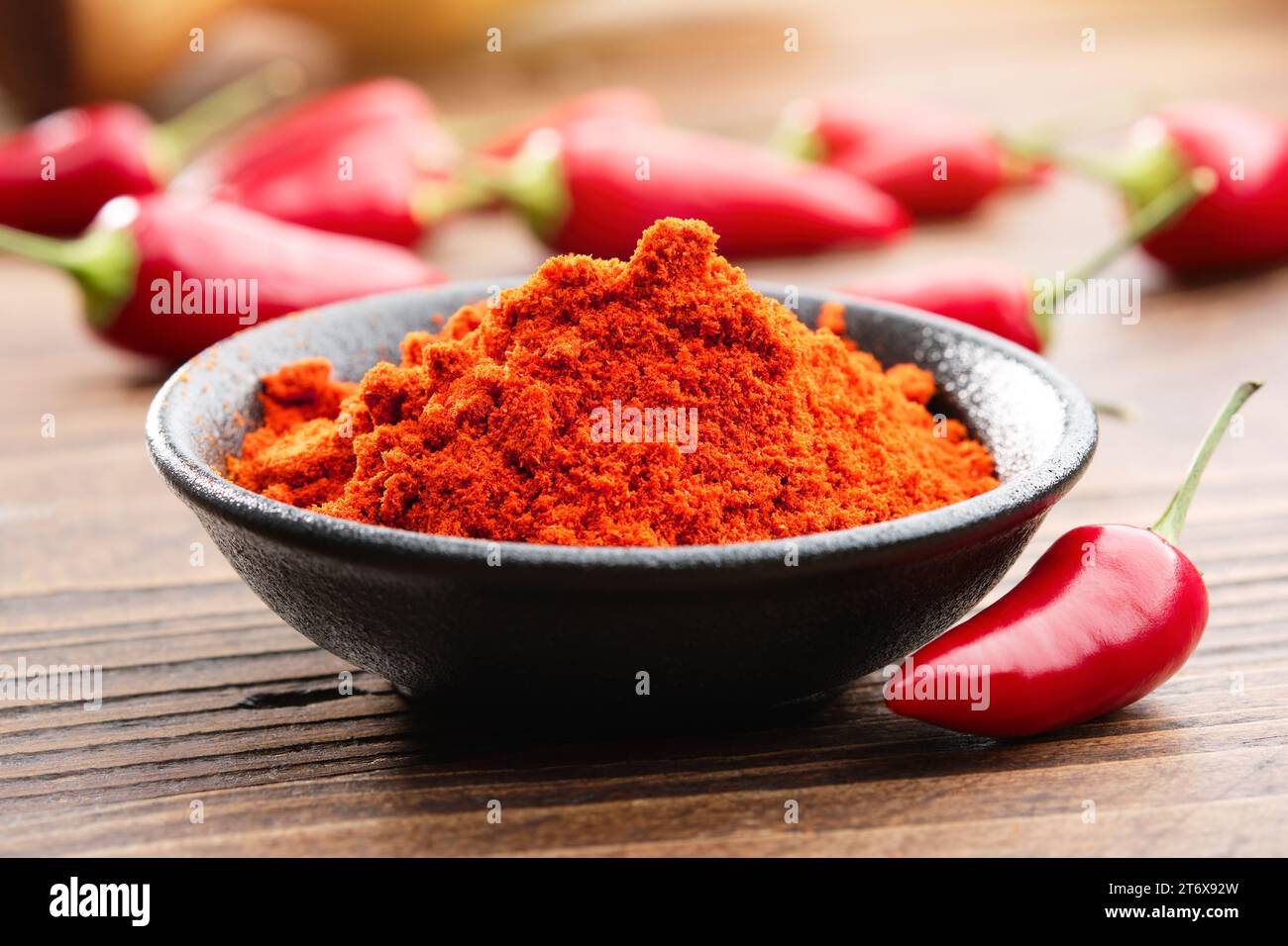 Bowl of red chili pepper ground to powder and whole redred hot pepper ...