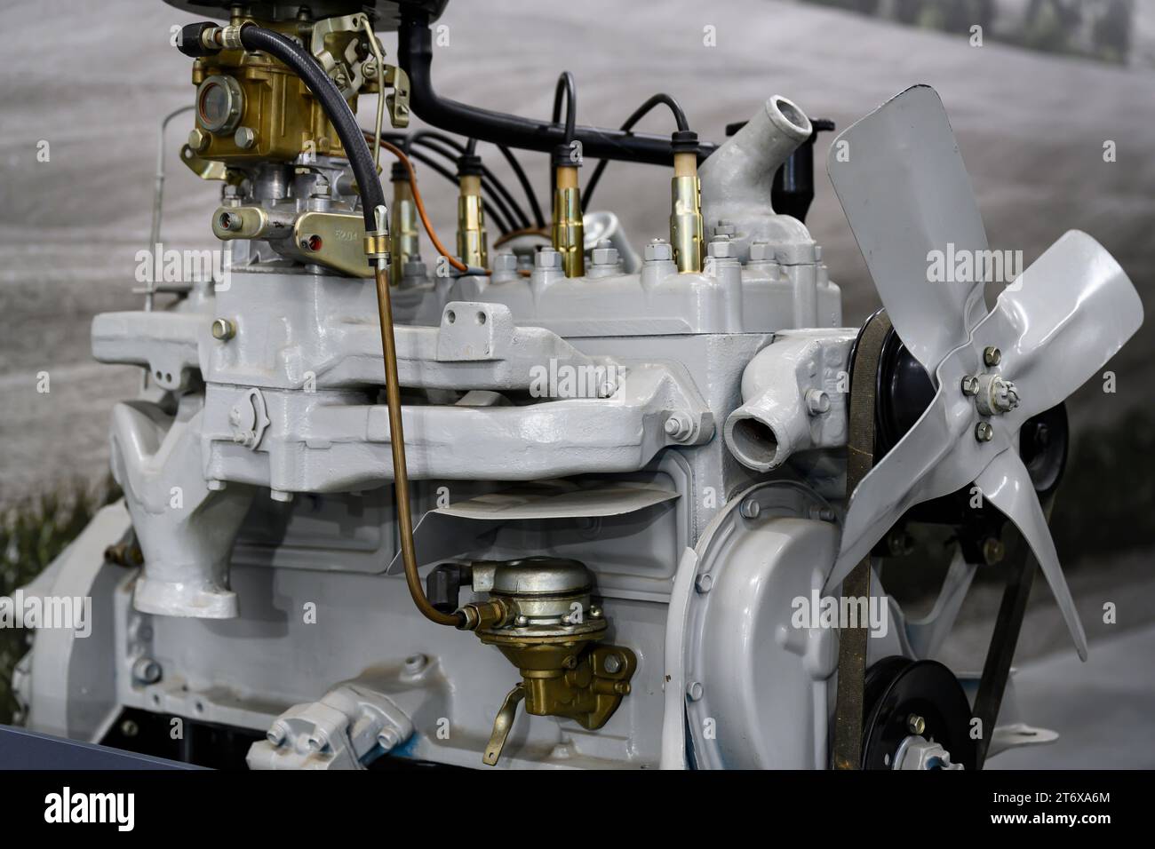 The engine of a mid-20th century truck with a carburetor and candles ...