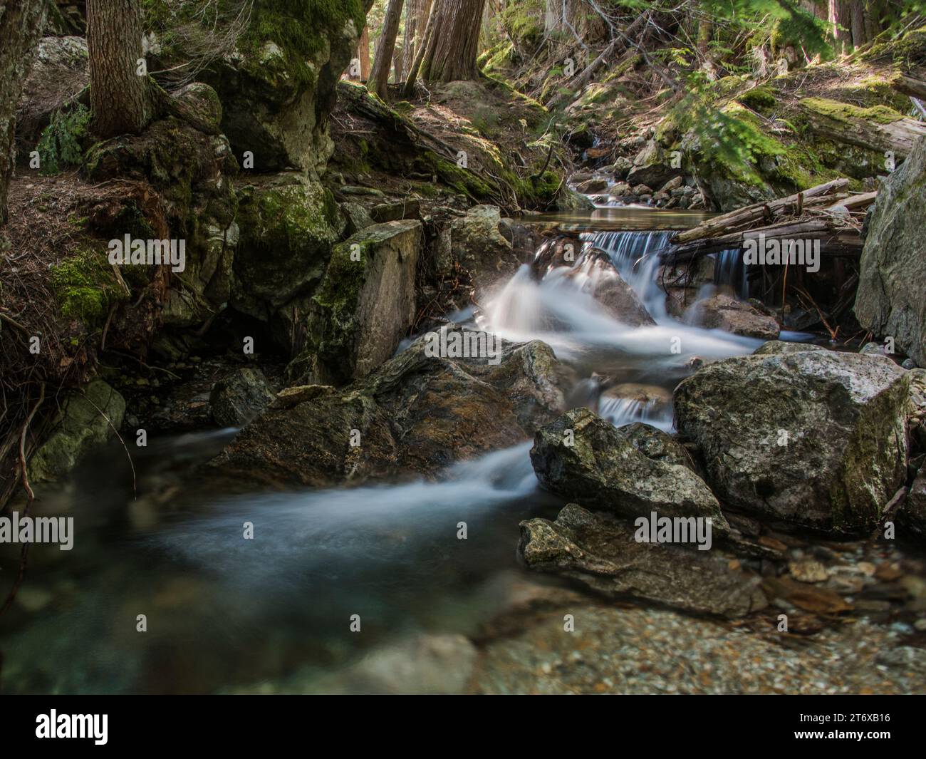 Small waterfall with motion blur suggesting peace and calm, happy creek ...