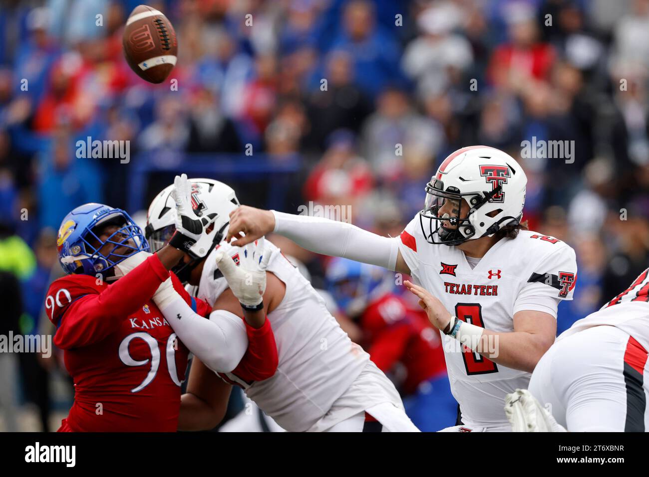 Kansas defensive lineman Jereme Robinson (90) blocks a pass from Texas ...