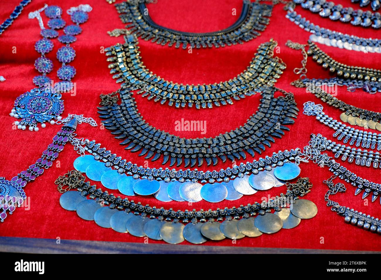 colorful traditional indian jewelry displayed in a street shop for sale ...