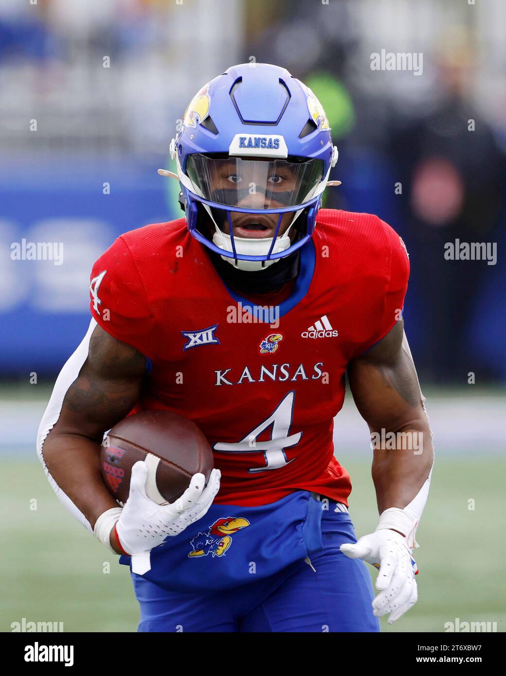 Kansas running back Devin Neal (4) rushes for yardage during the second ...