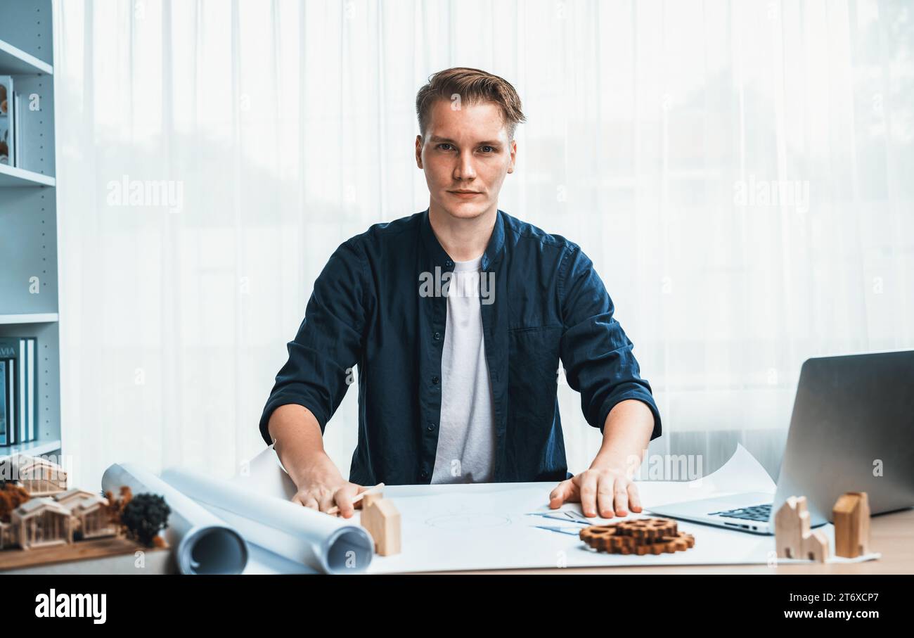 Portrait of architect designer sit at desk in office, brainstorm idea ...