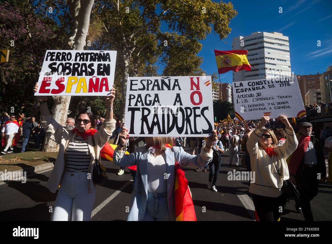 Protesters hold placards expressing their opinion during a ...