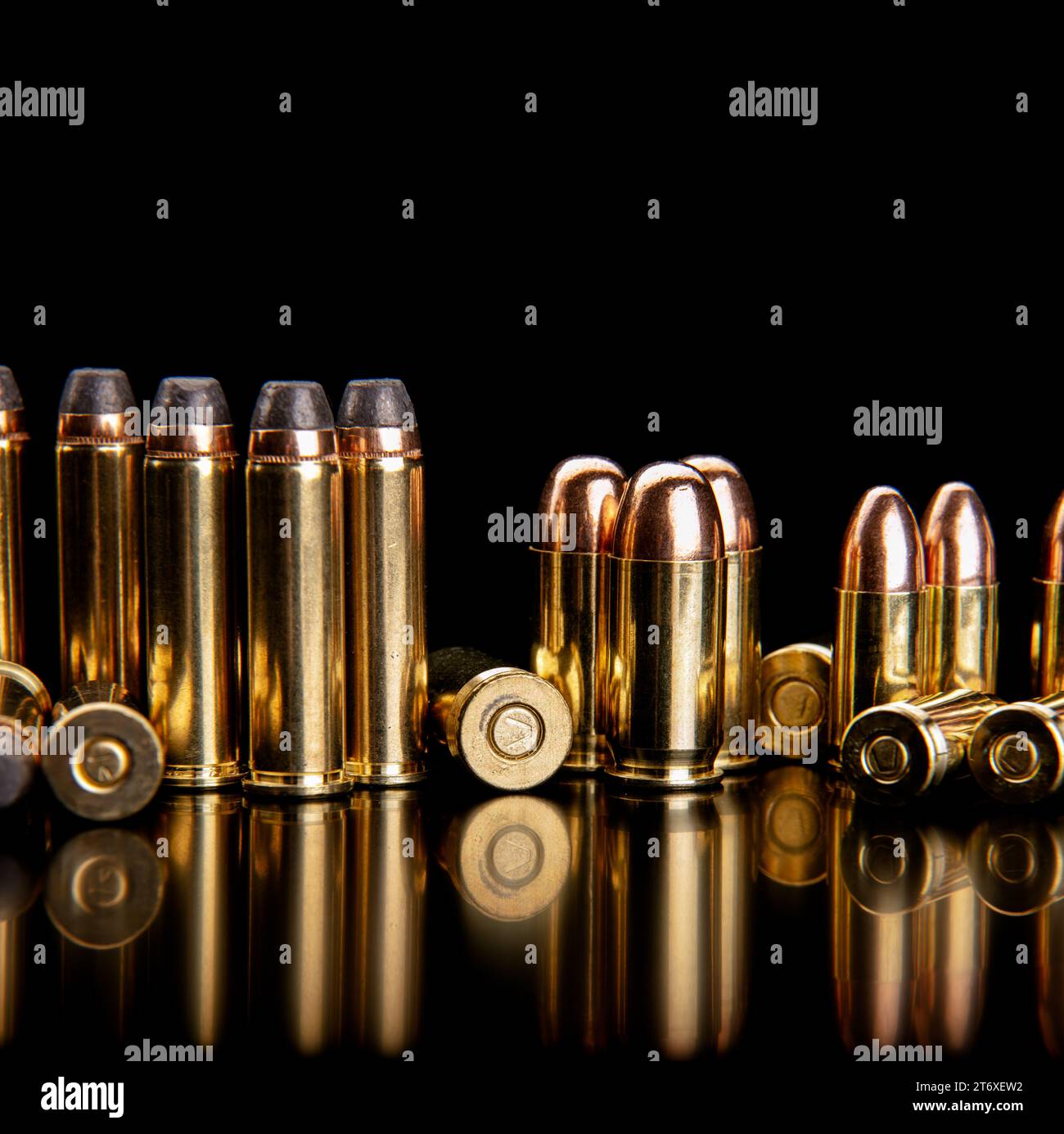 Bullet isolated on black background with reflexion. Rifle bullets close ...