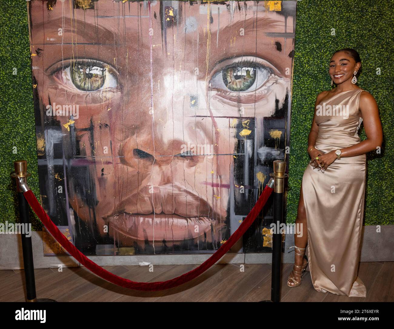 Featured Artist Peyton Burnett with her painting attends 3rd Annual ...