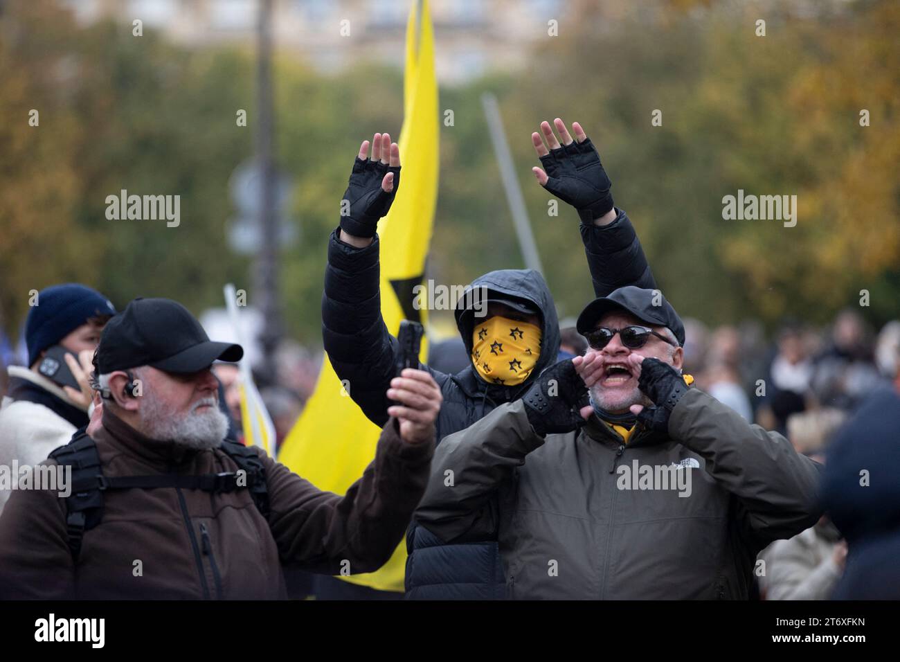 People wearing neck coverings with the logo of the Jewish Defense ...