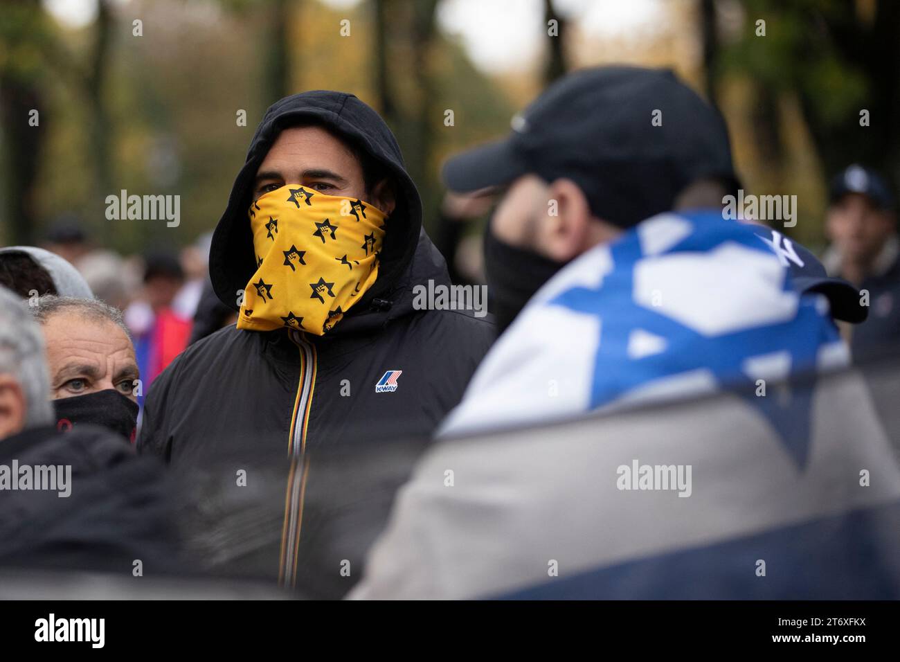 People wearing neck coverings with the logo of the Jewish Defense ...