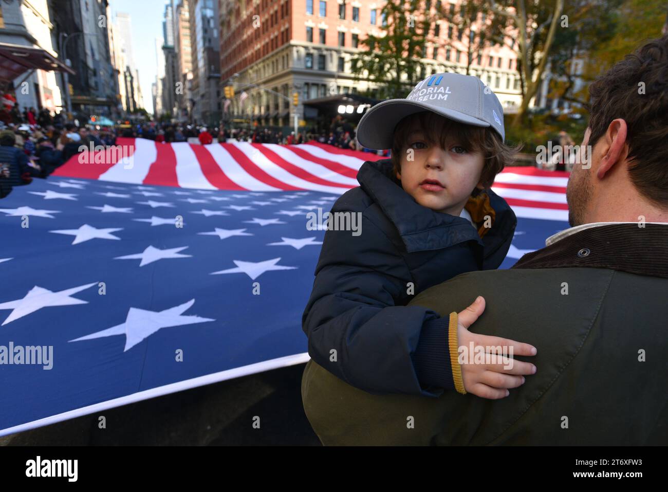 Volunteers carry the Ground Zero Flag during the 104th annual New York ...
