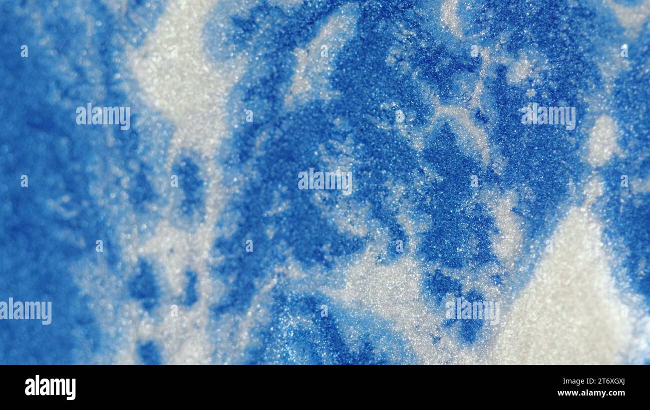 Sparkling ink glitter fluid texture blue white Stock Photo - Alamy