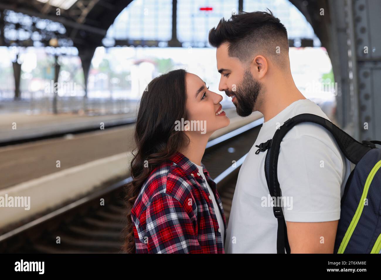 Long-distance relationship. Beautiful couple on platform of railway ...