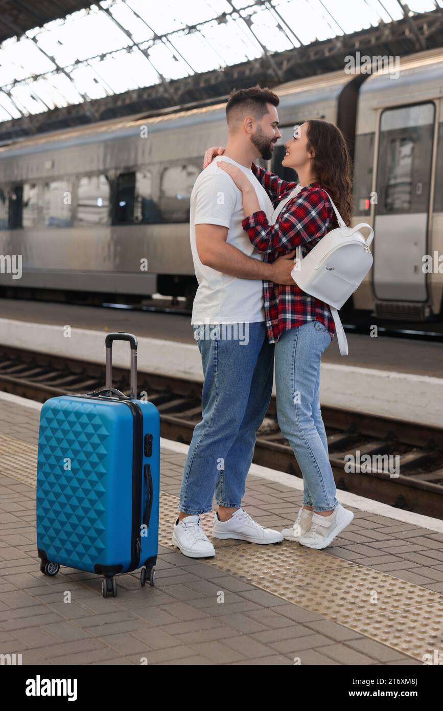 Long-distance relationship. Beautiful couple on platform of railway station Stock Photo - Alamy