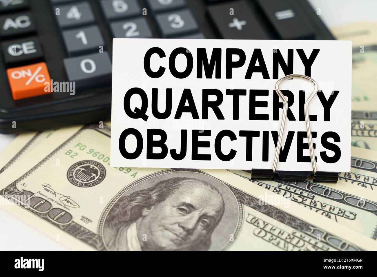 Business concept. On the dollars there is a calculator and a business ...