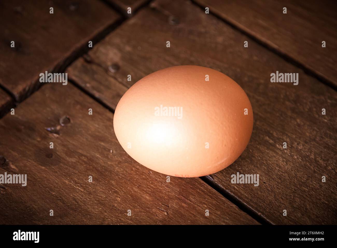 Fresh egg on a rustic wooden board background Stock Photo - Alamy