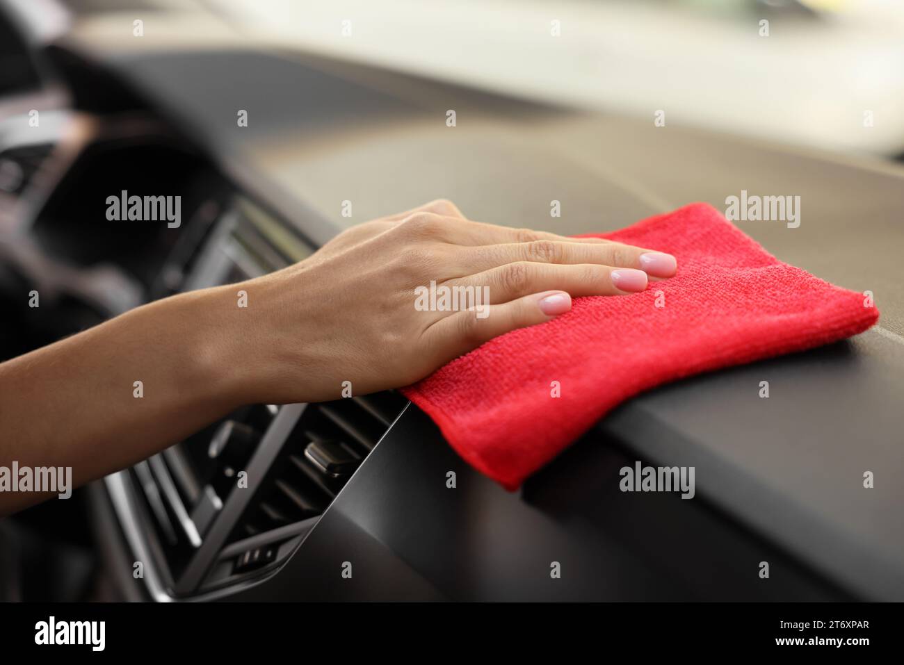 Woman cleaning car interior with rag, closeup Stock Photo - Alamy